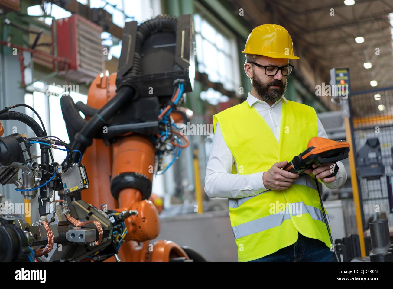 Automation engineer holding scanner in industrial in factory Stock ...
