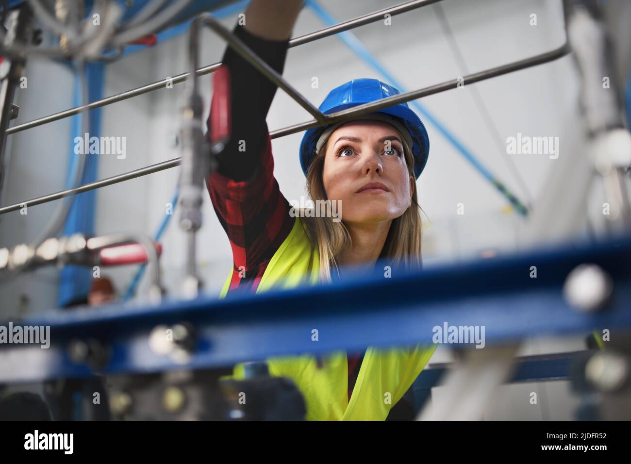 Portrait of female engineer working in industrial factory Stock Photo - Alamy