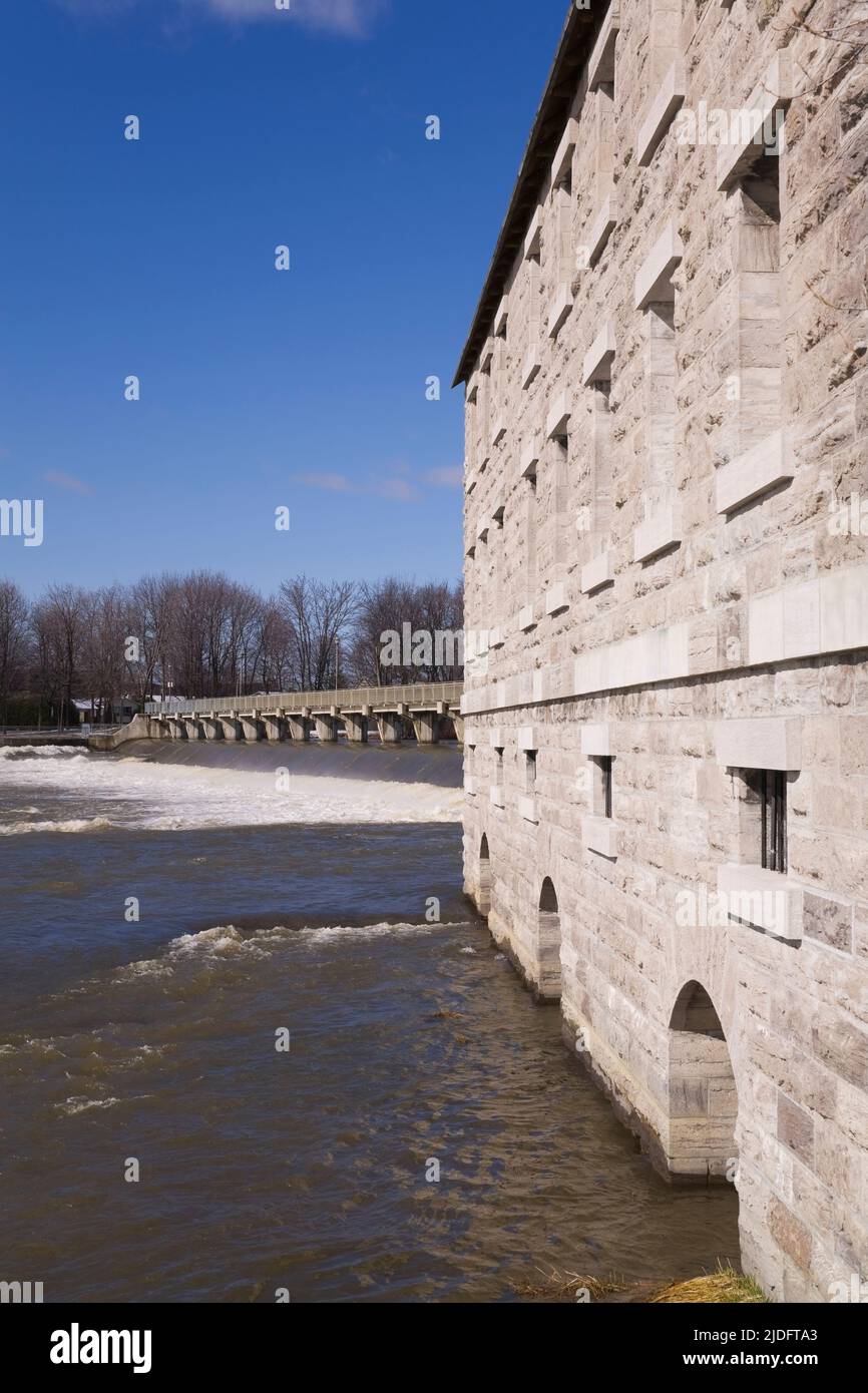 New Mill building and water flow control dam on Riviere des Mille-Iles ...