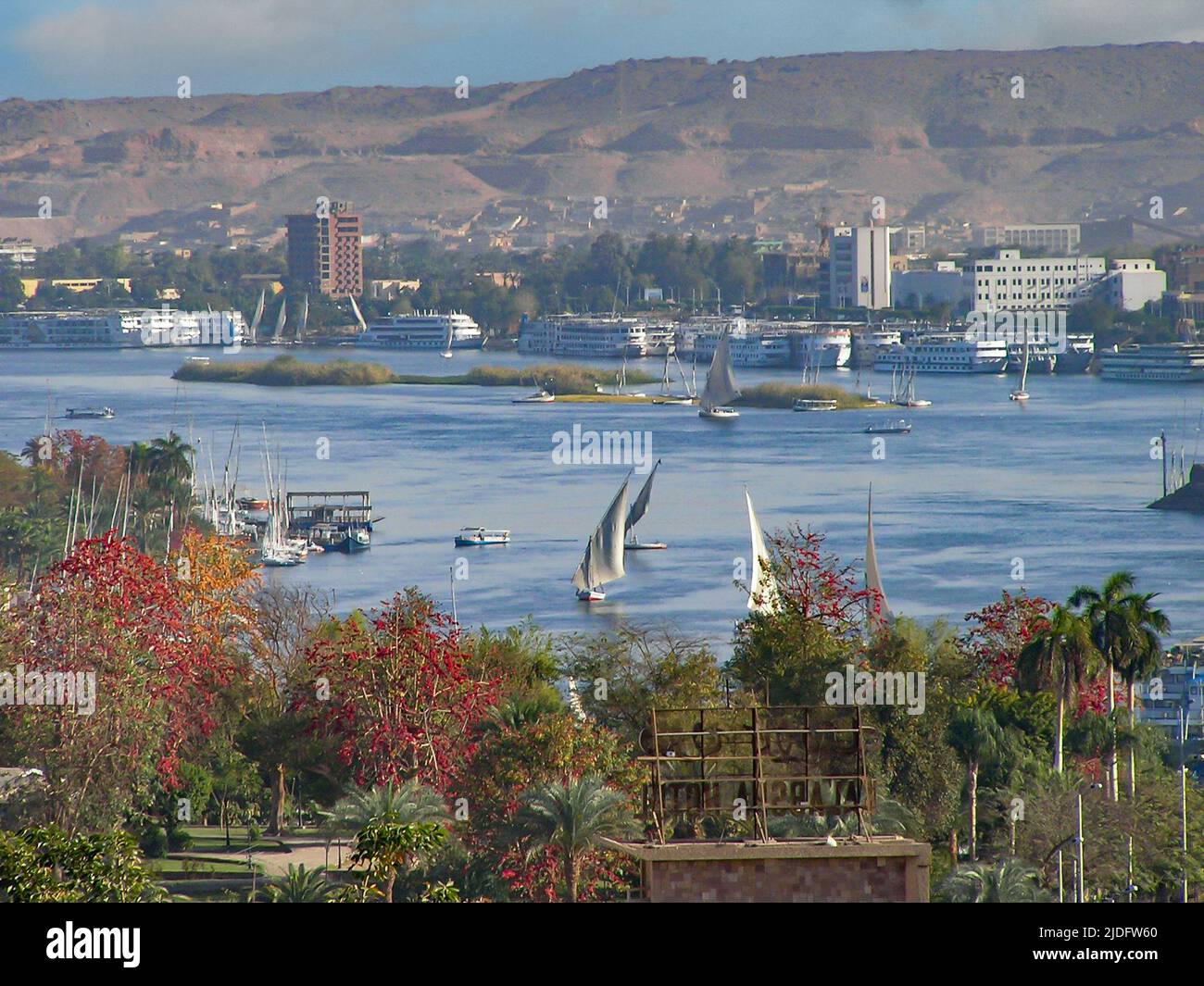 view of Aswan city and its lake and felucas in the haze, Egypt, AAfrica ...