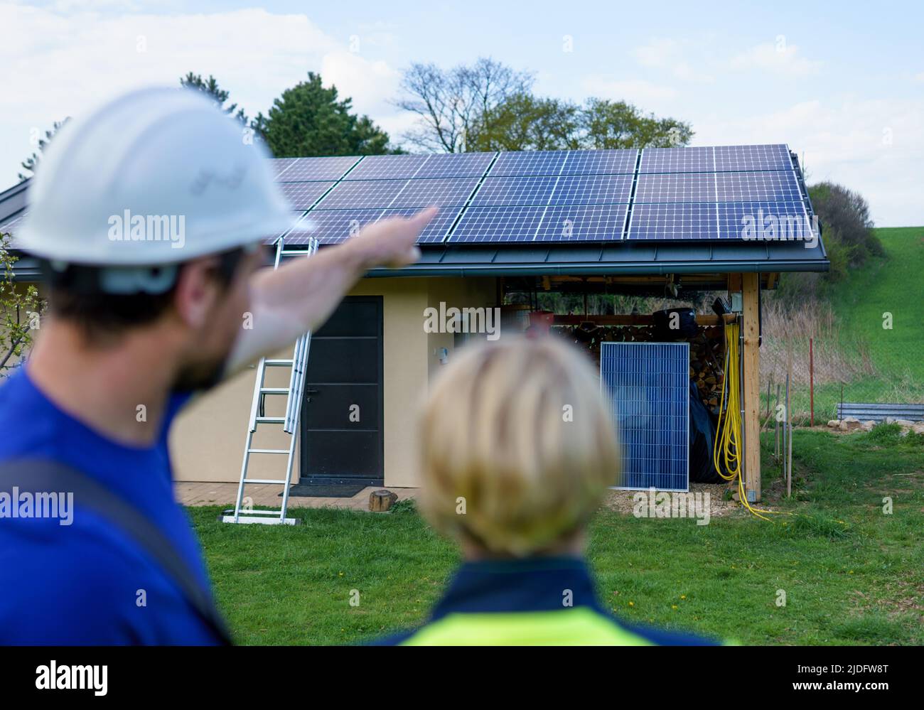 Solar panel man and woman hi-res stock photography and images - Alamy
