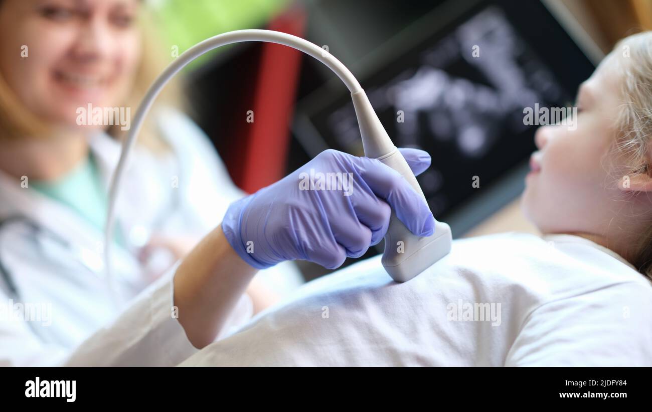 Close-up of diagnostic examination of internal organs in children using ...