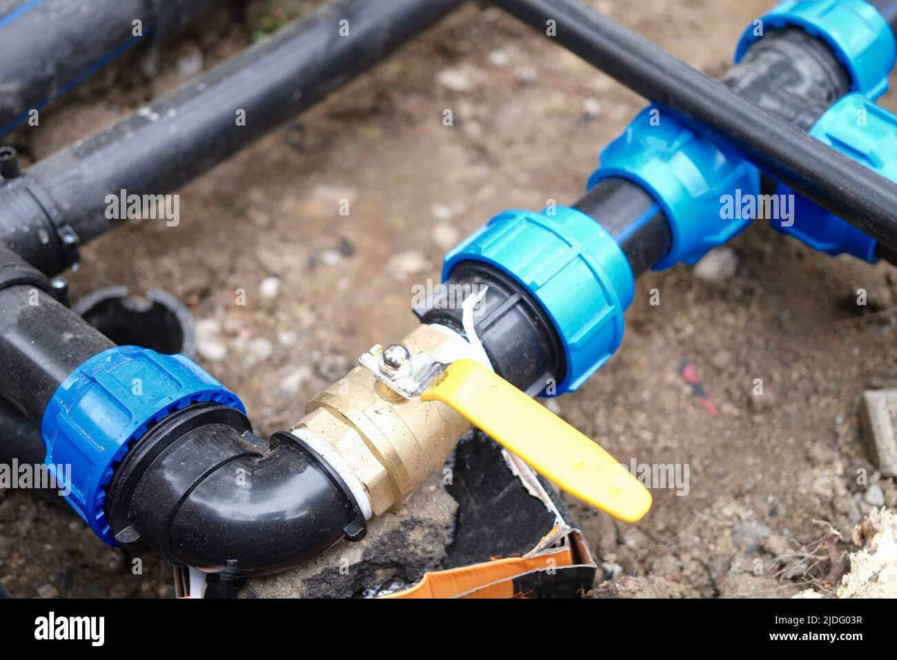 Elbow fitting of pvc pipes at bend with tap or faucet Stock Photo - Alamy