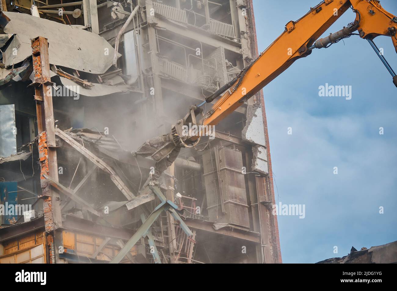 Destroying of old industrial building by excavator destroyer Stock ...