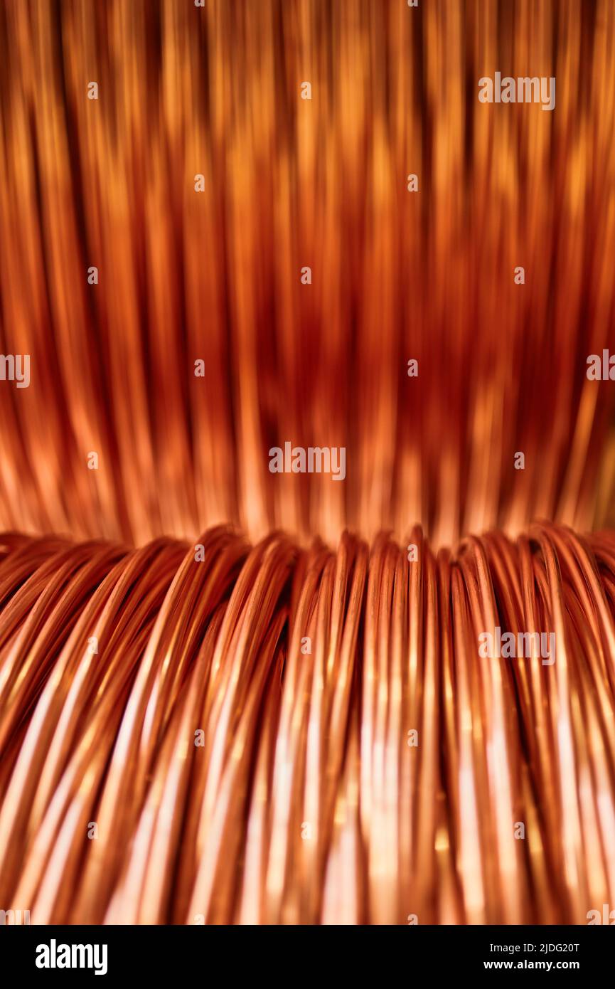 Large bobbin of orange copper wire in light warehouse Stock Photo - Alamy