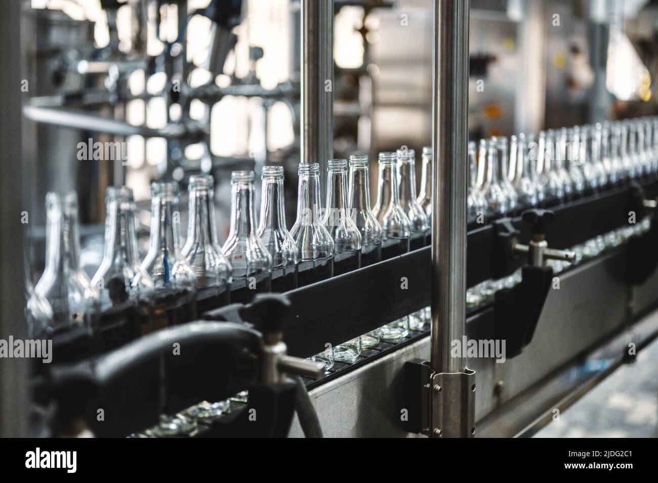Row of glass bottles to fill with expensive alcohol drinks Stock Photo ...