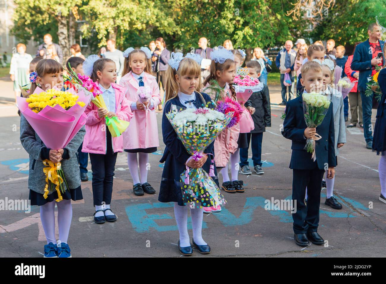 Meeting with the first-grade pupils and teacher at schoolyard. The day ...