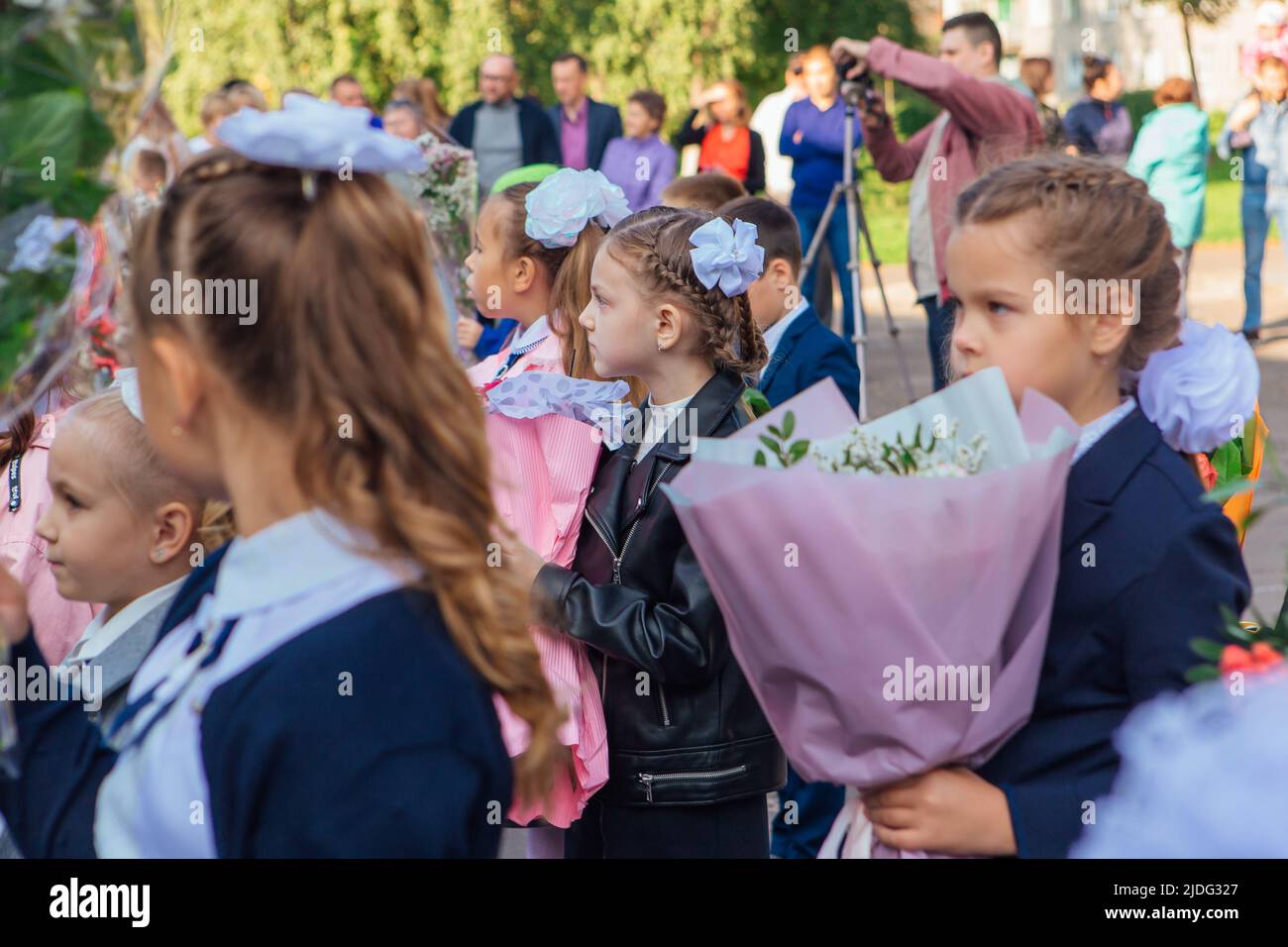 Meeting with the first-grade pupils and teacher at schoolyard. The day ...
