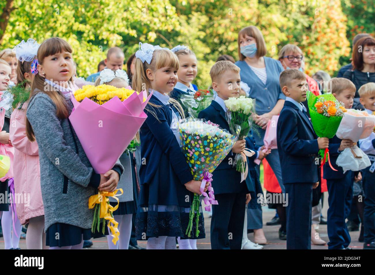 Meeting with the first-grade pupils and teacher at schoolyard. The day ...
