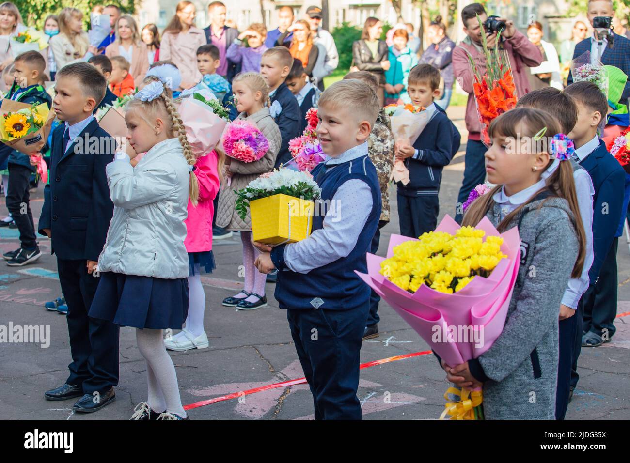 Meeting with the first-grade pupils and teacher at schoolyard. The day ...
