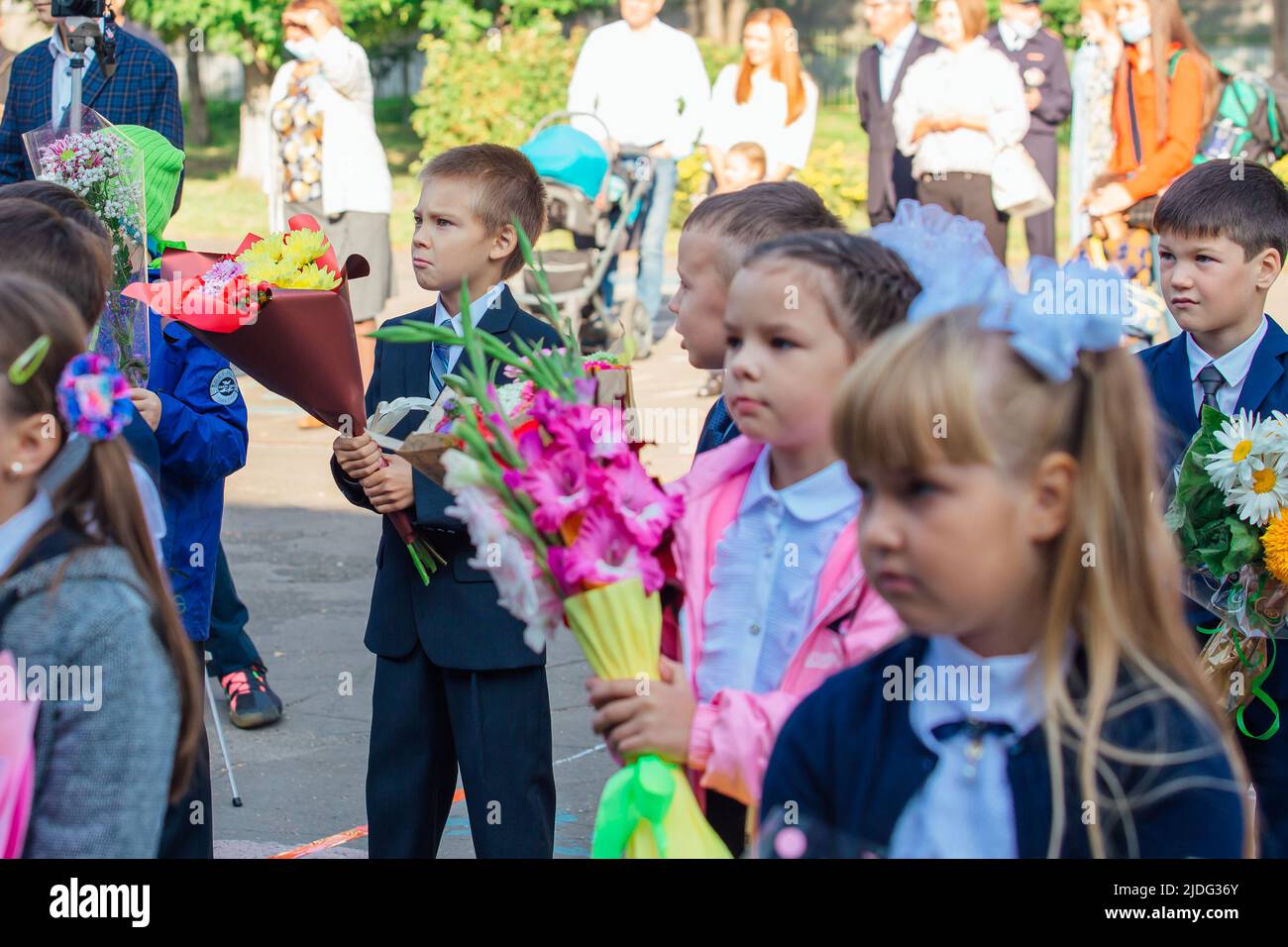 Meeting with the first-grade pupils and teacher at schoolyard. The day ...