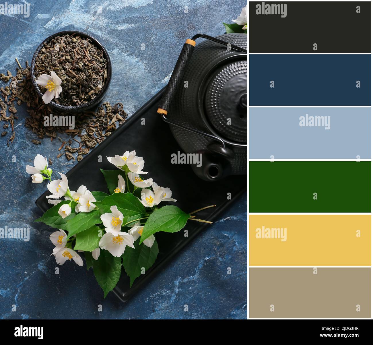 Composition with dry green tea and jasmine flowers on blue background ...