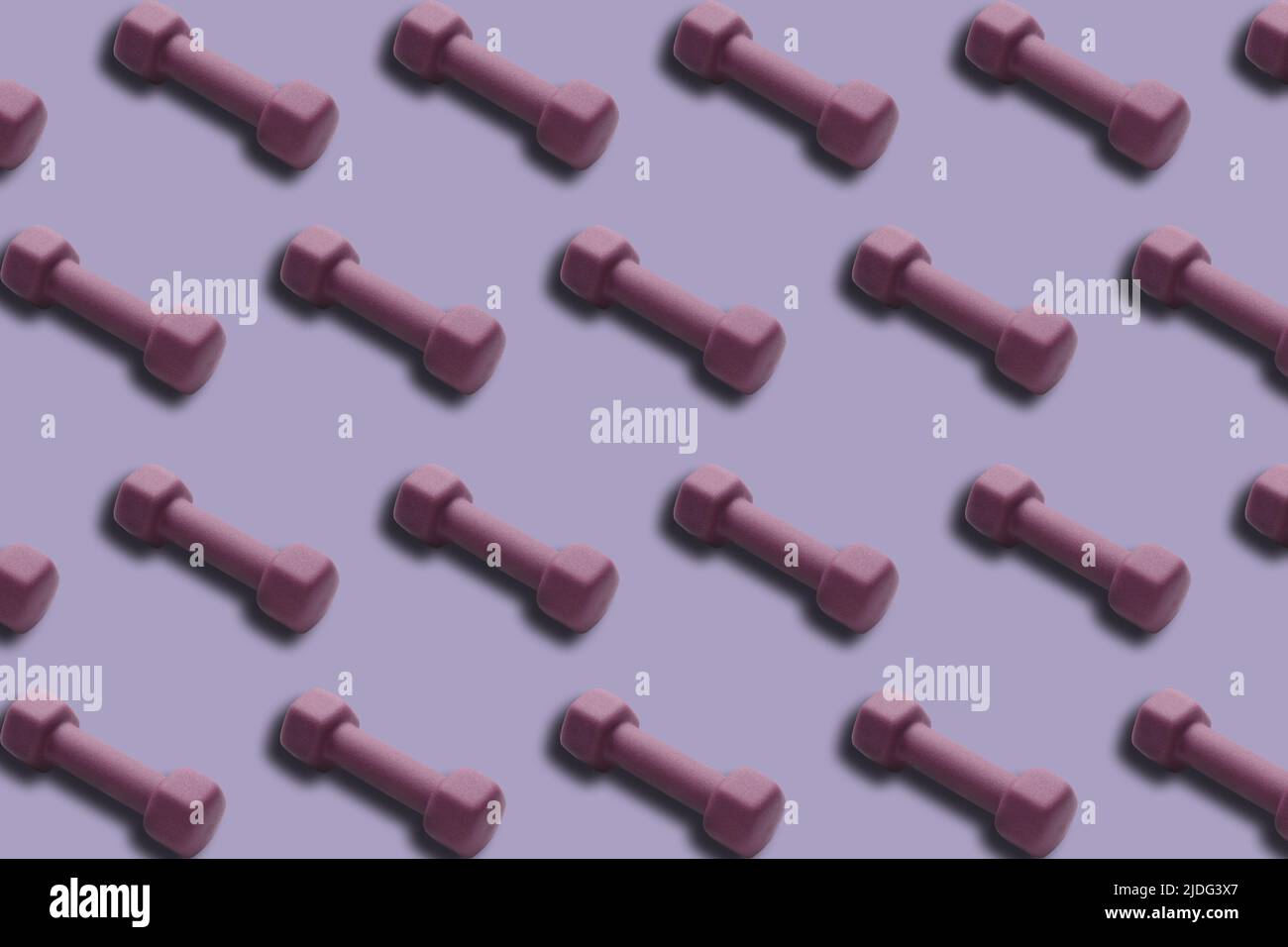 Many dumbbells on lilac background. Pattern for design Stock Photo - Alamy