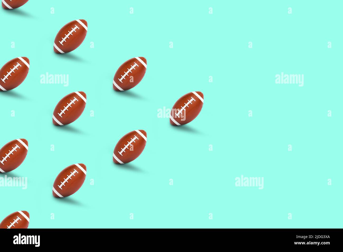 Many rugby balls on turquoise background with space for text Stock ...