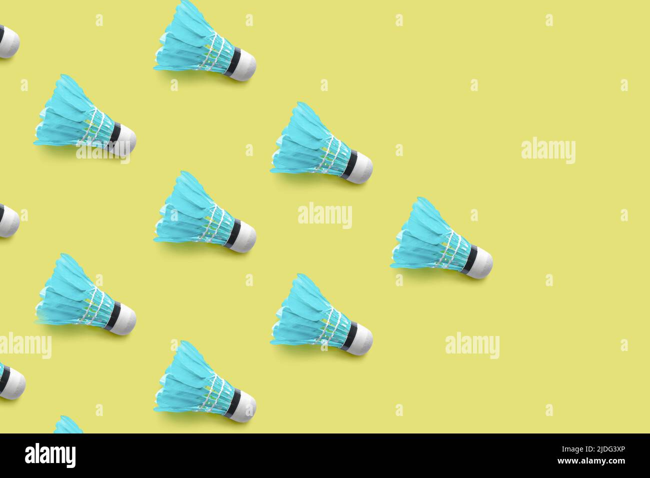 Many badminton shuttlecocks on yellow background. Pattern for design ...