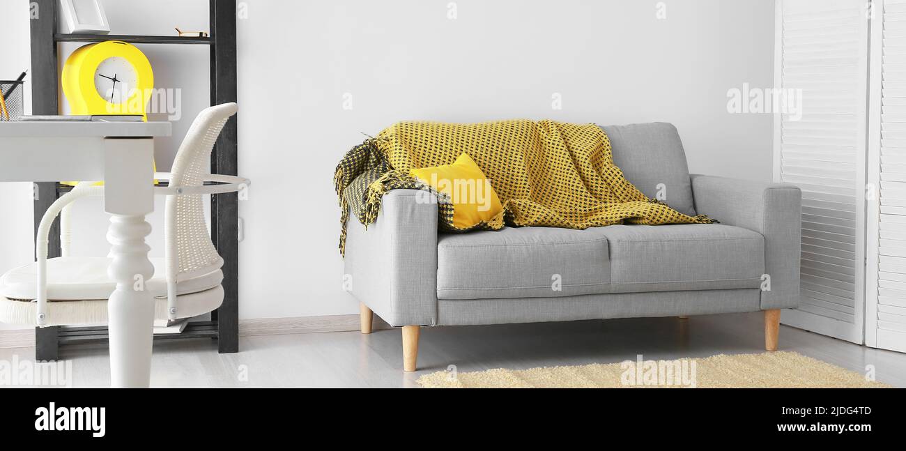 Stylish interior of living room with comfortable couch Stock Photo - Alamy