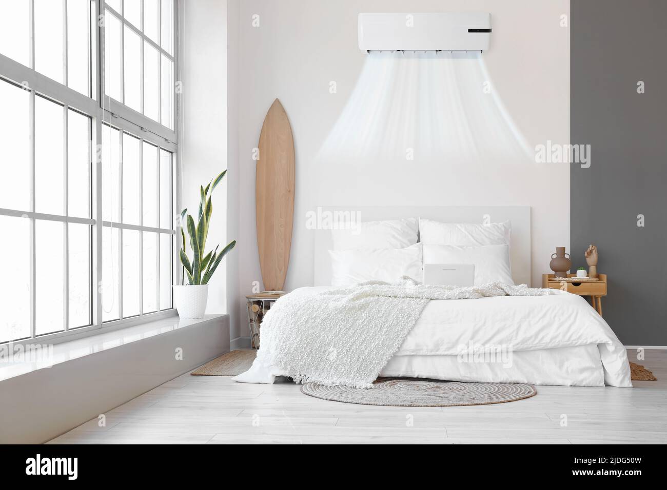 Interior of modern bedroom with operating air conditioner Stock Photo ...