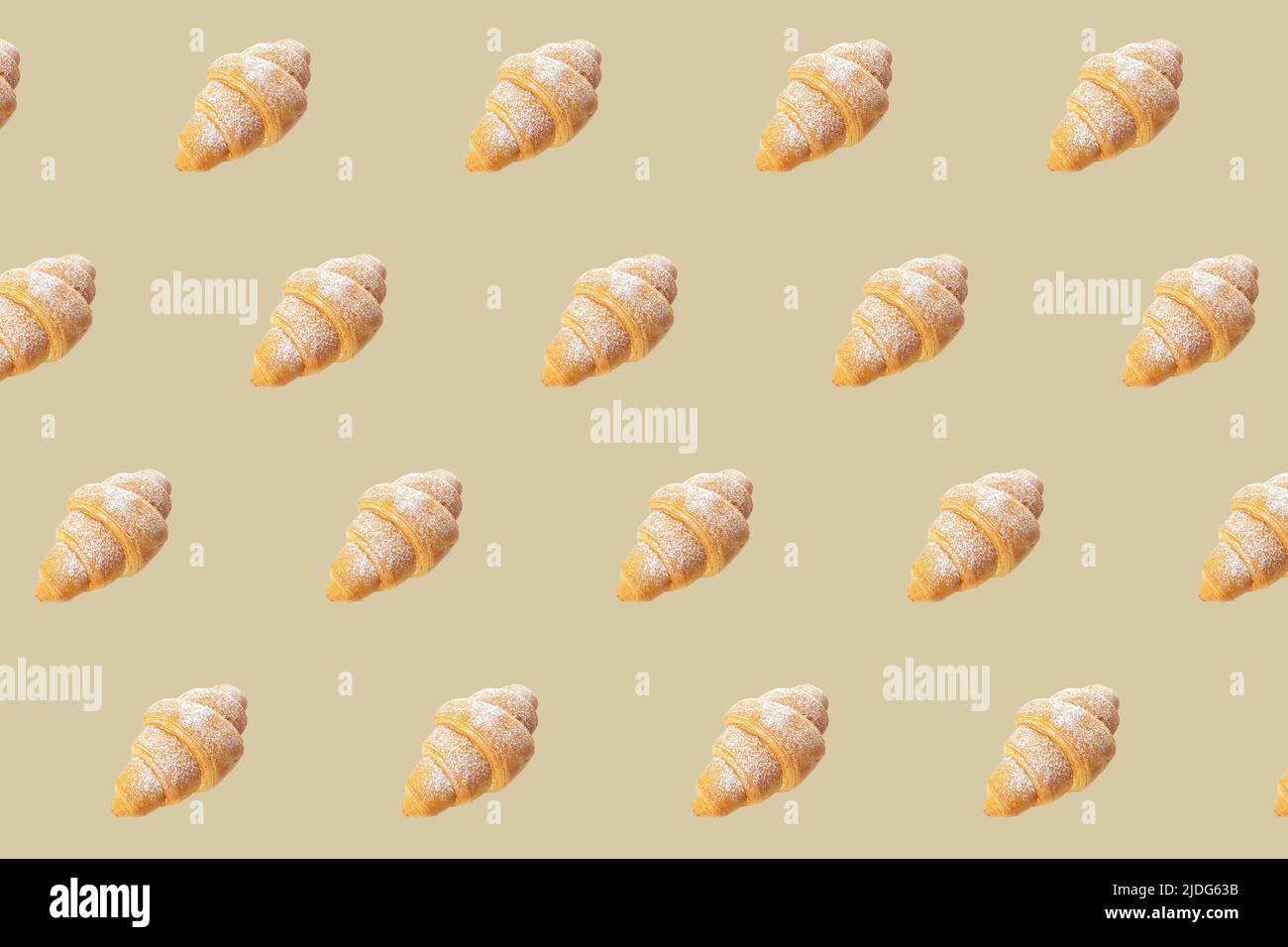 Many fresh croissants on beige background. Pattern for design Stock ...