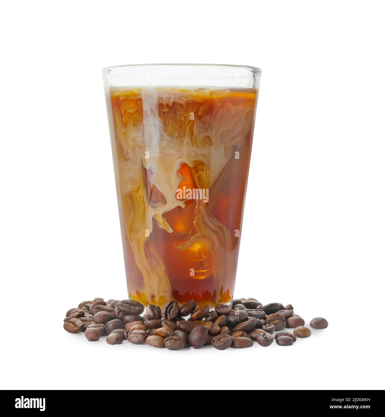Glass of cold brew with milk and coffee beans on white background Stock ...
