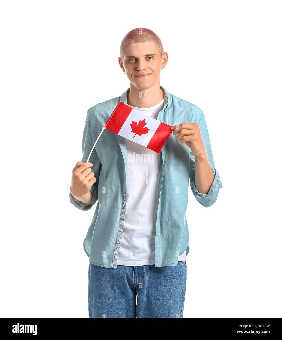 Young guy with Canadian flag on white background Stock Photo - Alamy