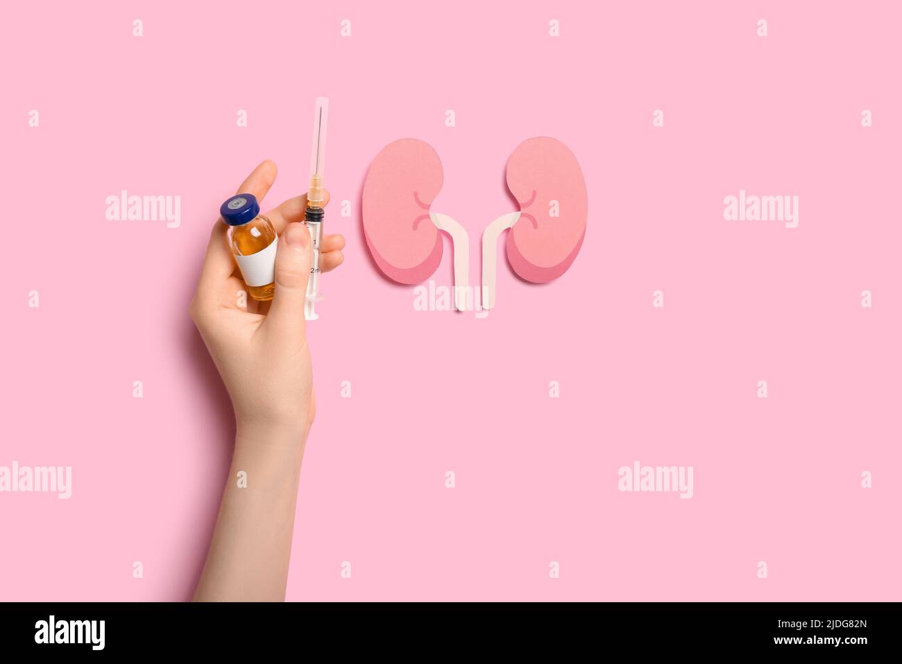 Woman with ampule, syringe and paper kidneys on pink background Stock ...