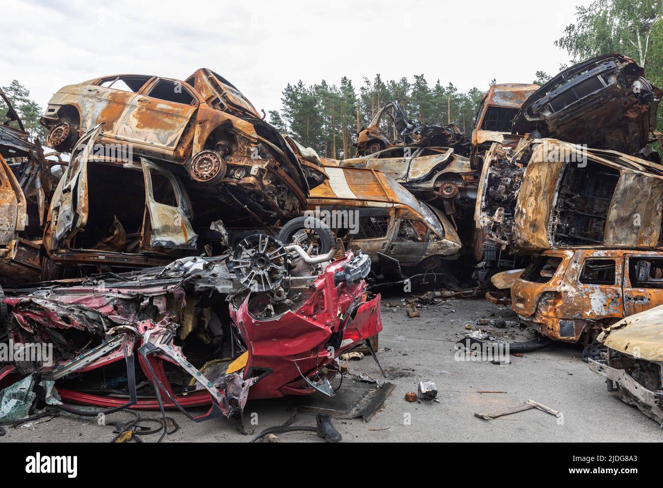 Cars destroyed amid Russia's attack on Ukraine are seen, after they ...