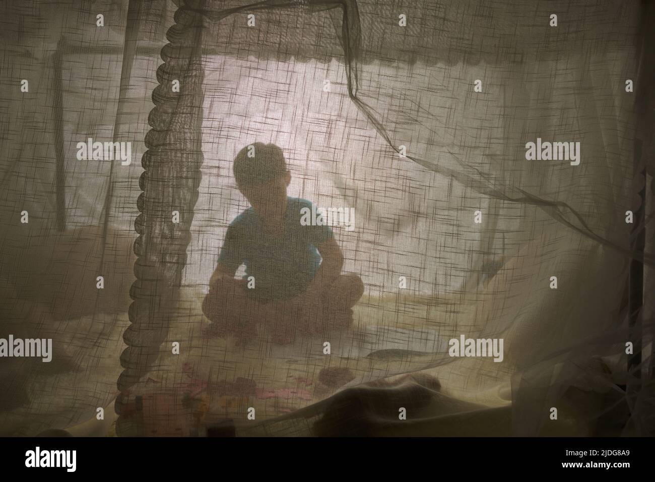 Silhouette of little boy playing inside tent house Stock Photo - Alamy