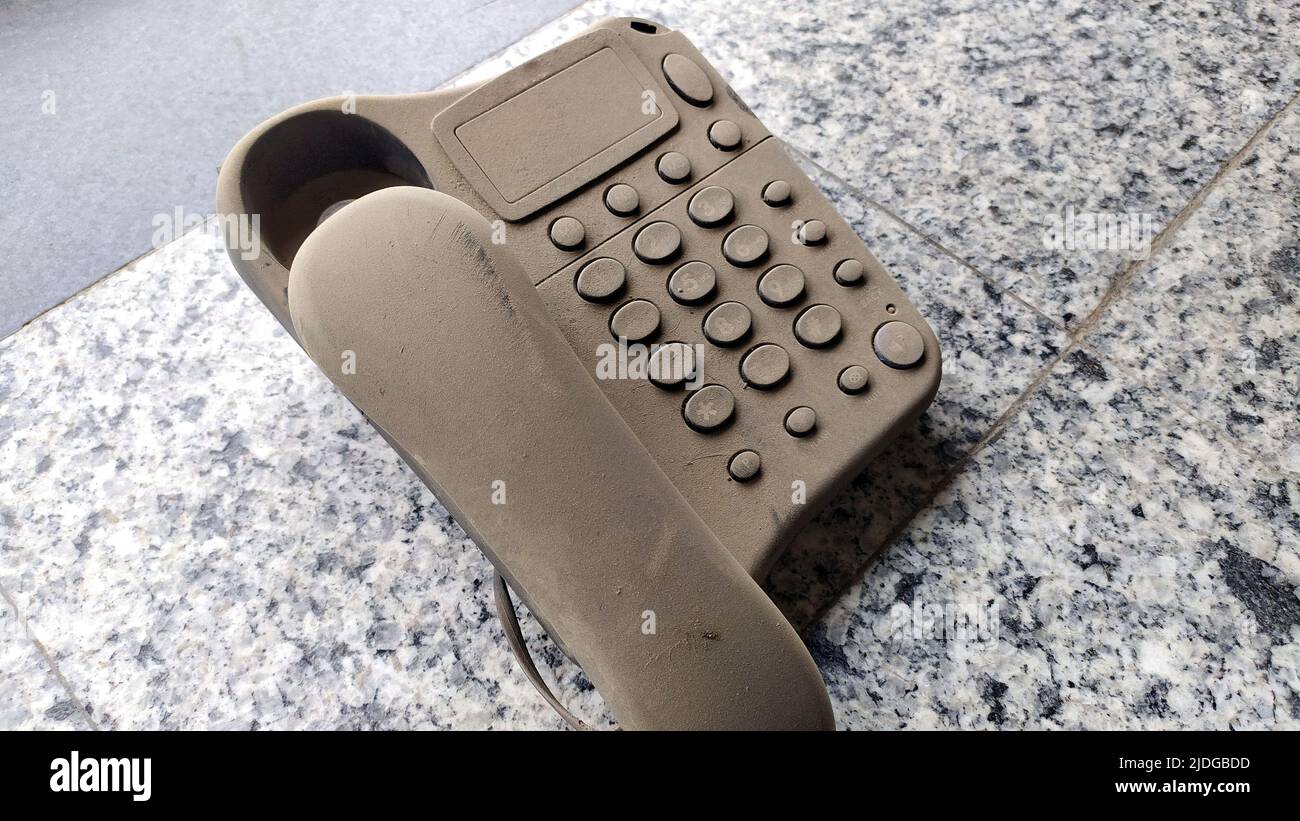 very old telephone with huge dust isolated on stone background Stock ...