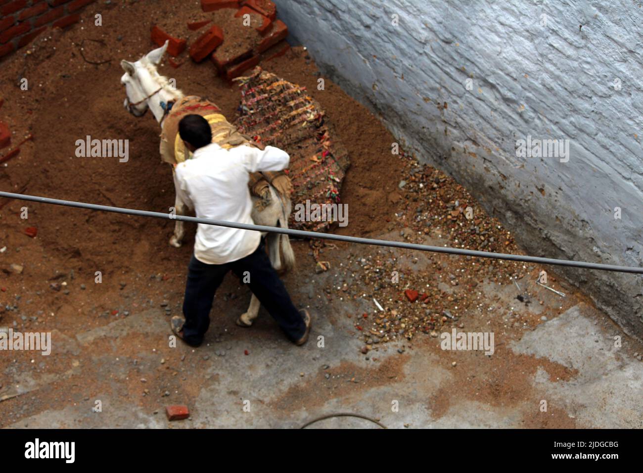 a worker doing work on construction site Stock Photo - Alamy