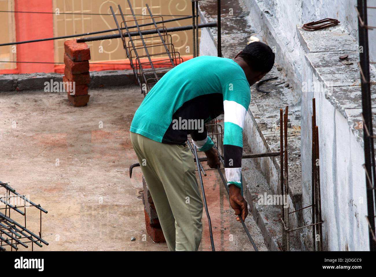 a worker doing work on construction site Stock Photo - Alamy