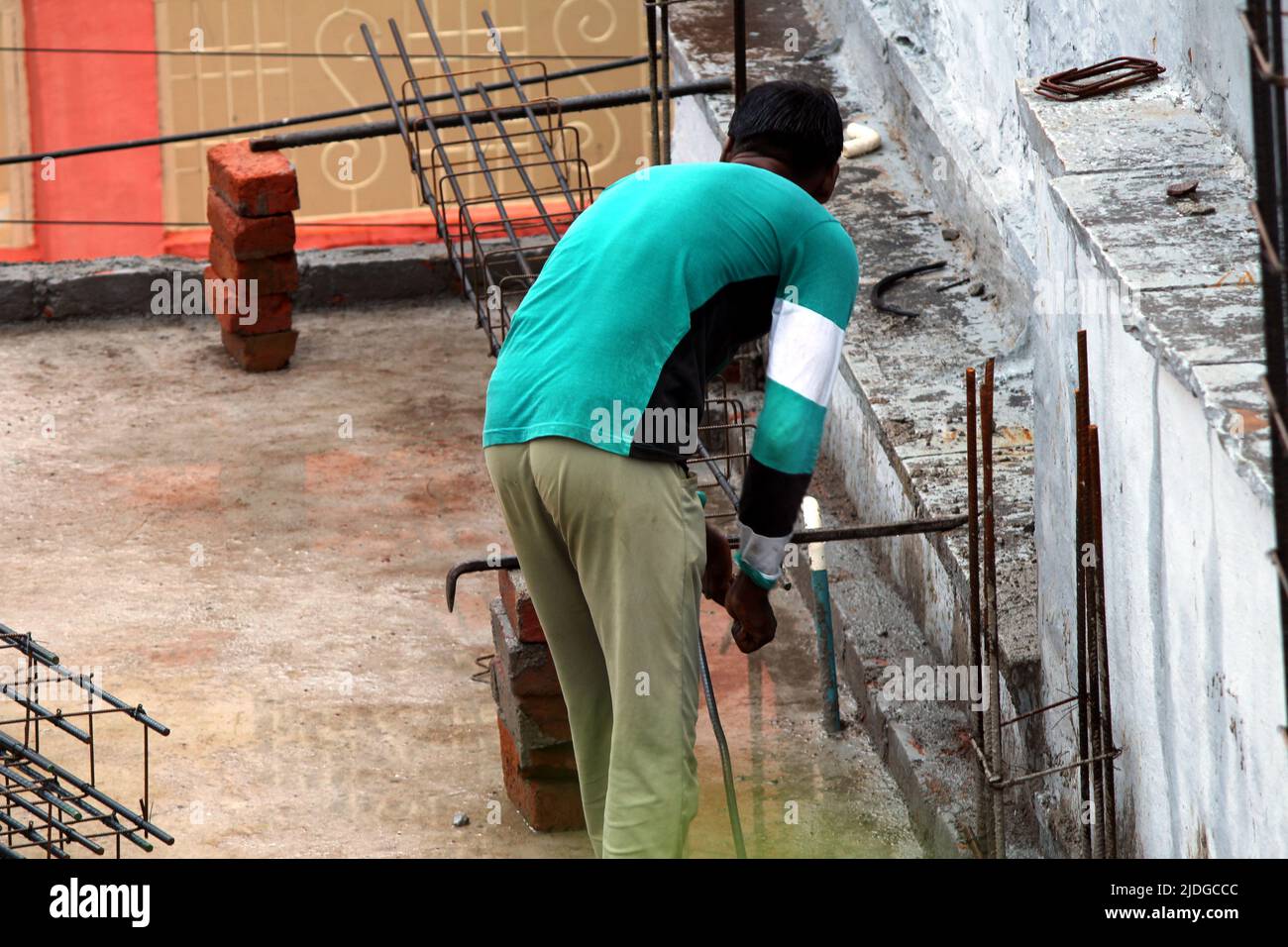 a worker doing work on construction site Stock Photo - Alamy
