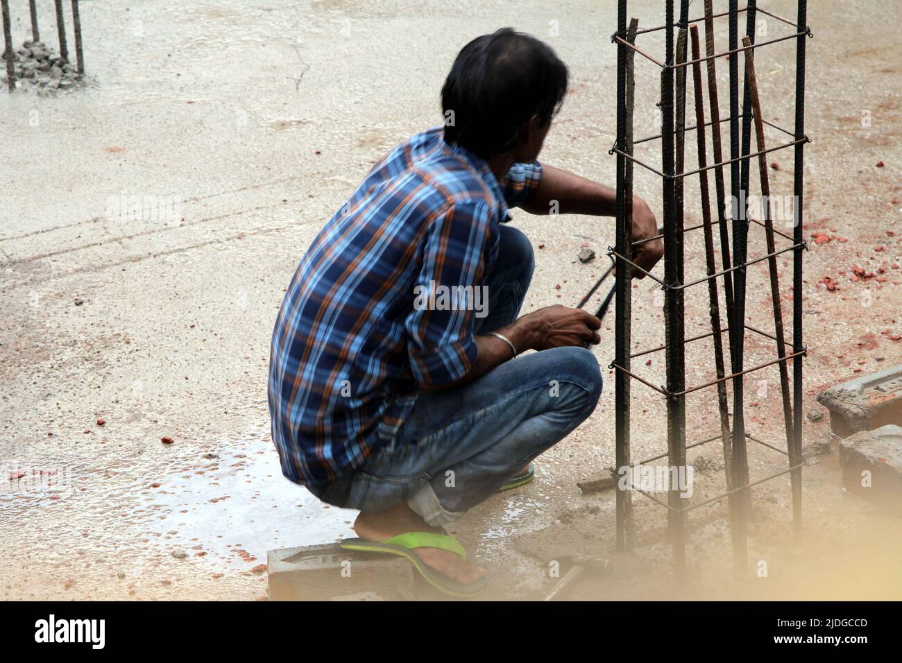 a worker doing work on construction site Stock Photo - Alamy