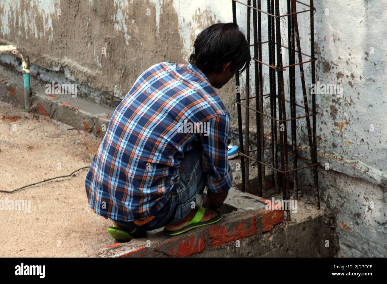 a worker doing work on construction site Stock Photo - Alamy