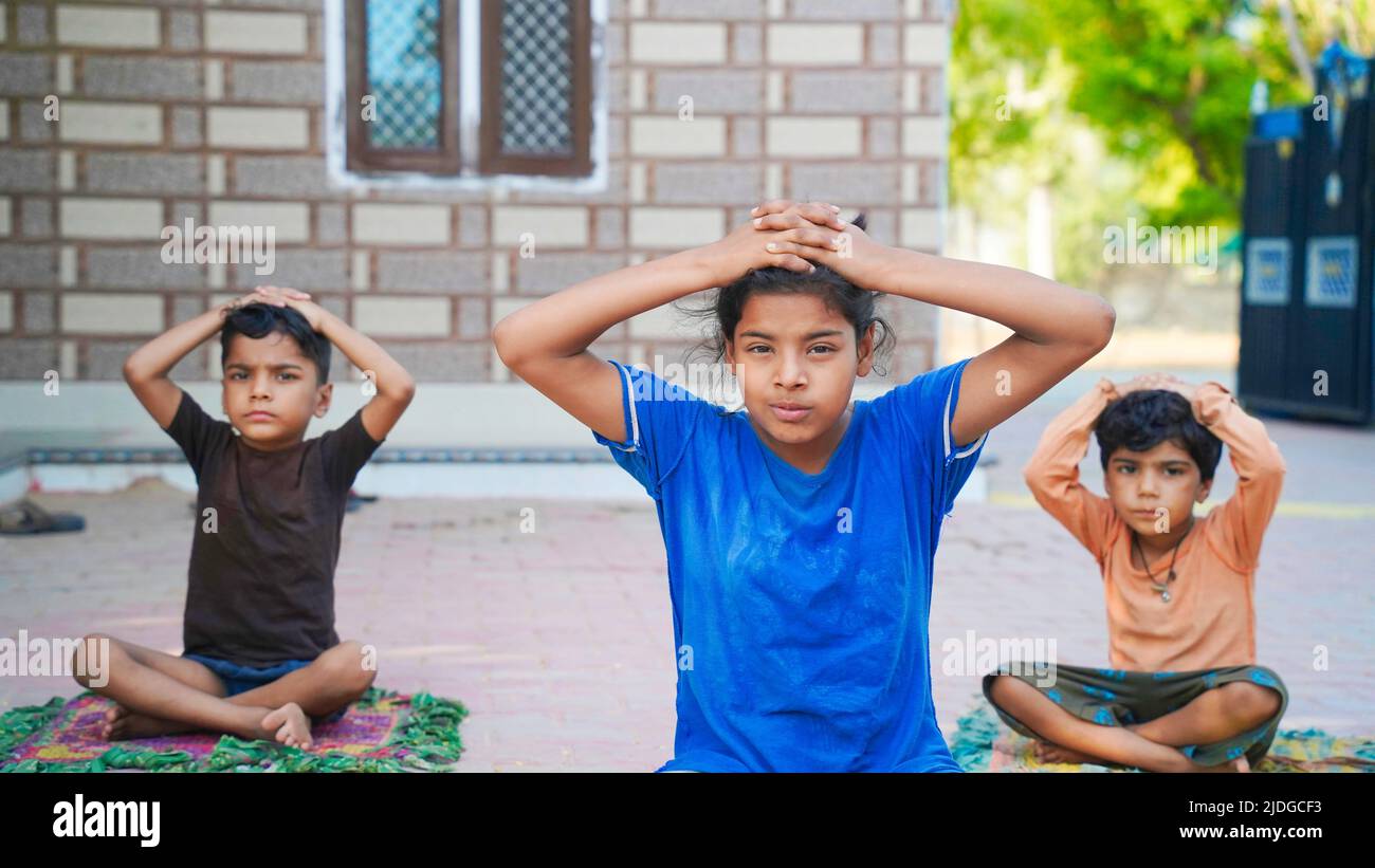 Happy indian girl child doing yoga hi-res stock photography and images ...