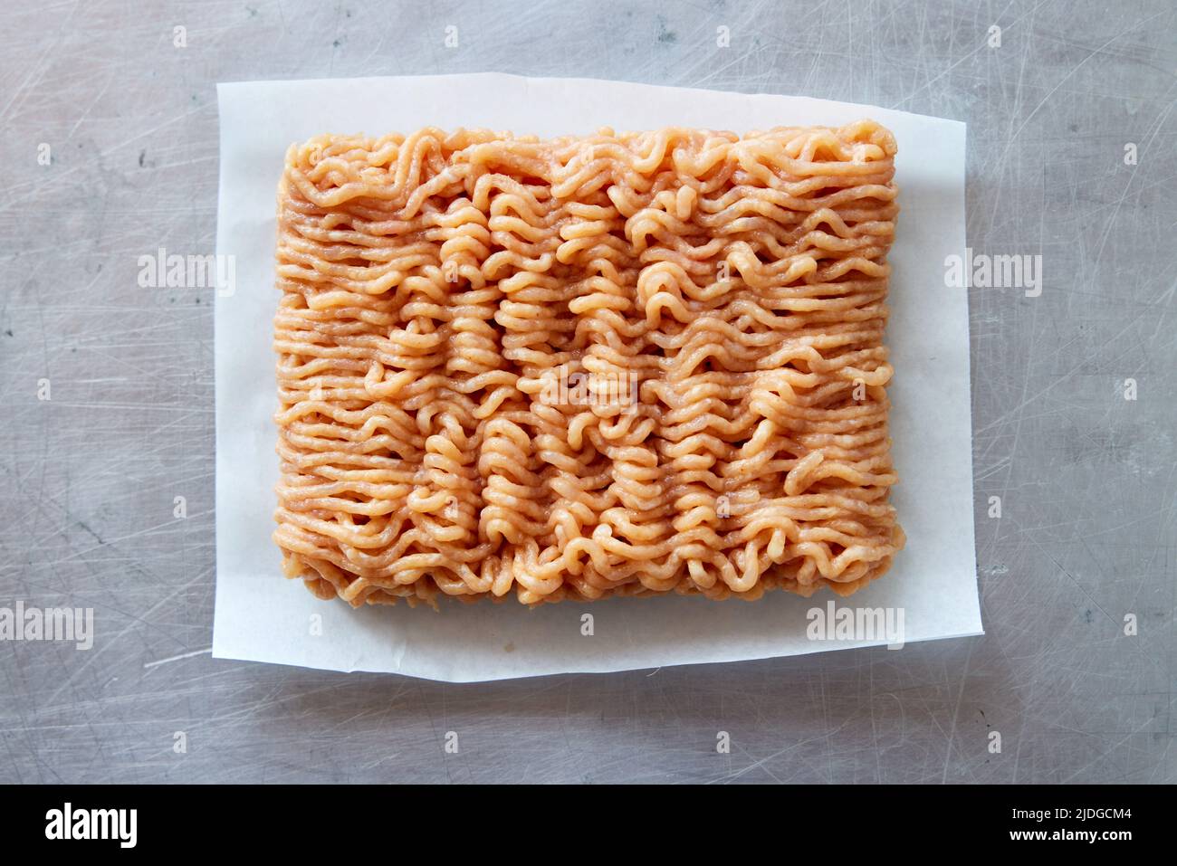 Top view of raw fresh chicken mince in white napkin placed on gray ...