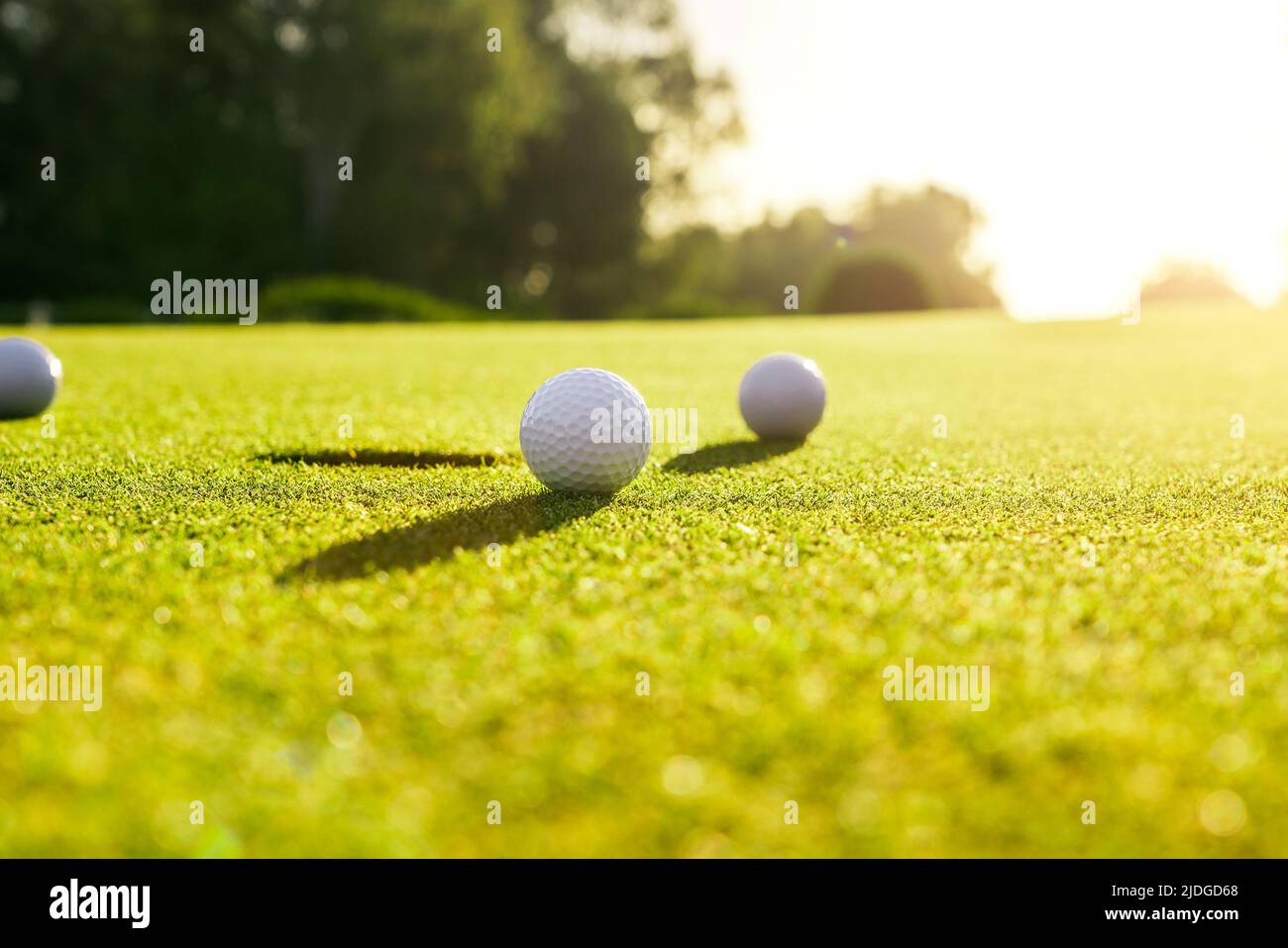 Golf three balls near hole hi-res stock photography and images - Alamy