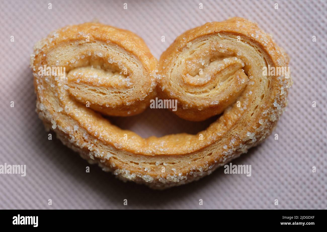 Tasty puff pastry cookie with sugar sprinkle Stock Photo - Alamy