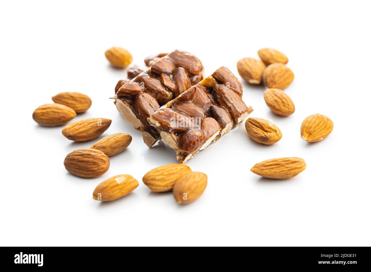 Almond nuts and sweet mini almond bars isolated on a white background ...