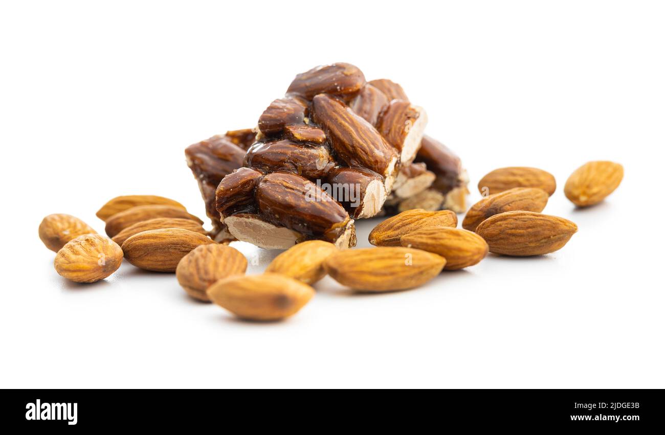Almond nuts and sweet mini almond bars isolated on a white background ...