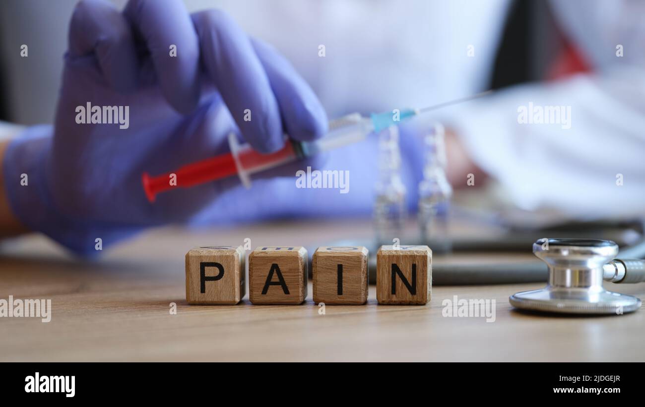 Word pain collected of wooden cubes in raw Stock Photo - Alamy