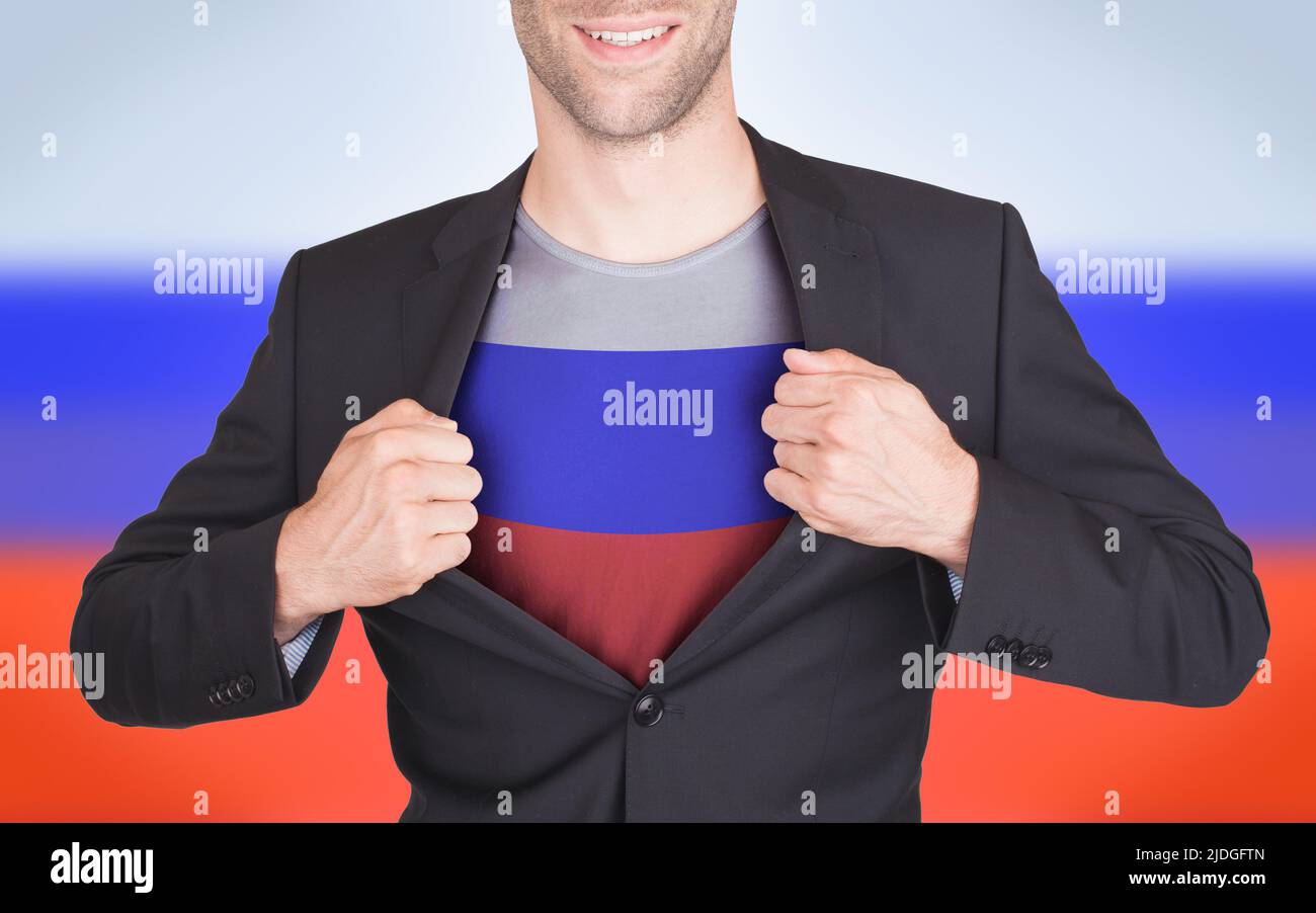 Man showing it's shirt, the colors of Russia, Russian background Stock ...