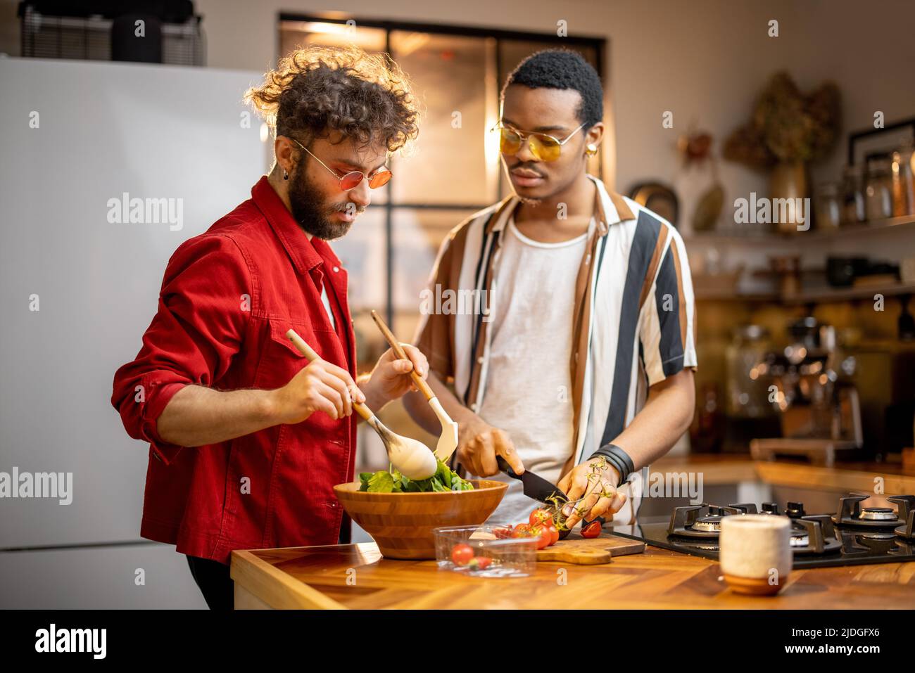 Two gay men cooking hi-res stock photography and images - Alamy