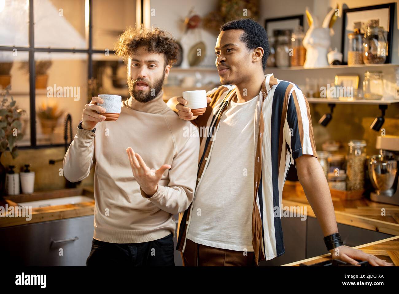 Latino couple talking kitchen hi-res stock photography and images - Alamy