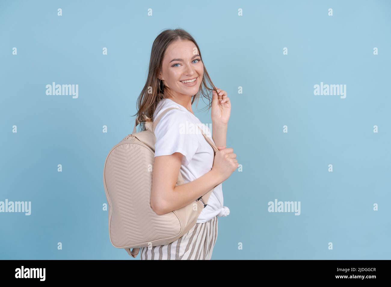 Positive college student girl holding backpack on her back ...