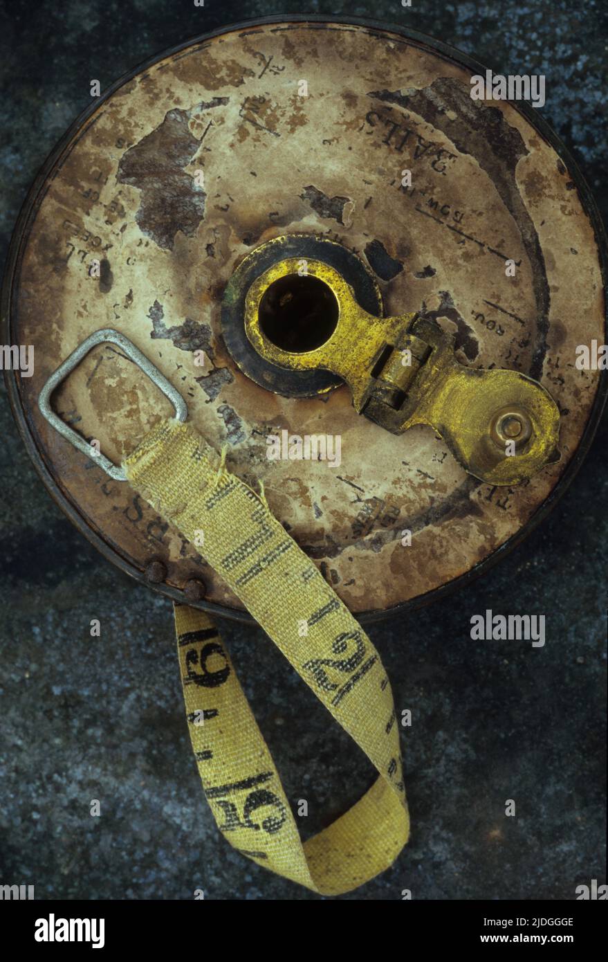 Groundsmans measuring tape in well worn metal case with brass winding ...
