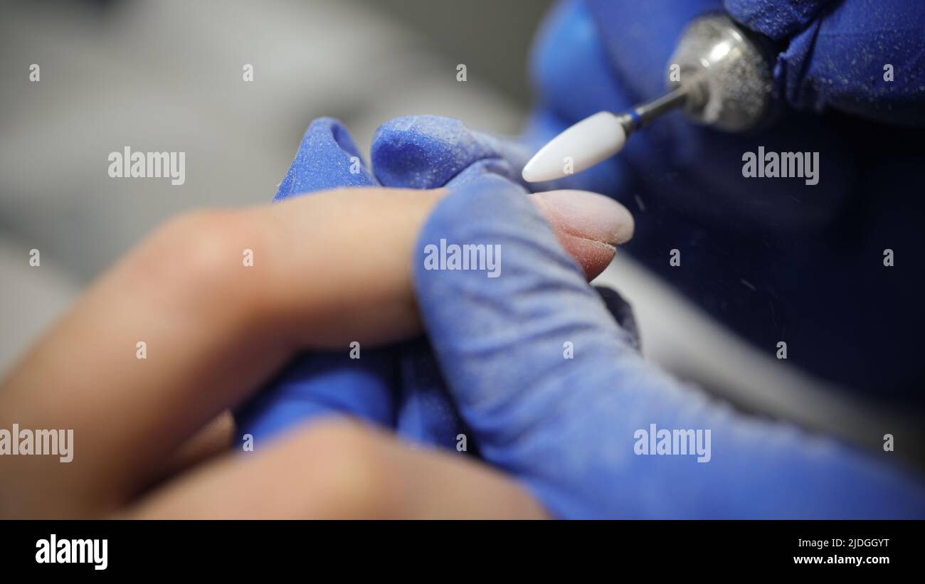 Female manicurist doing manicure hardware hi-res stock photography and ...