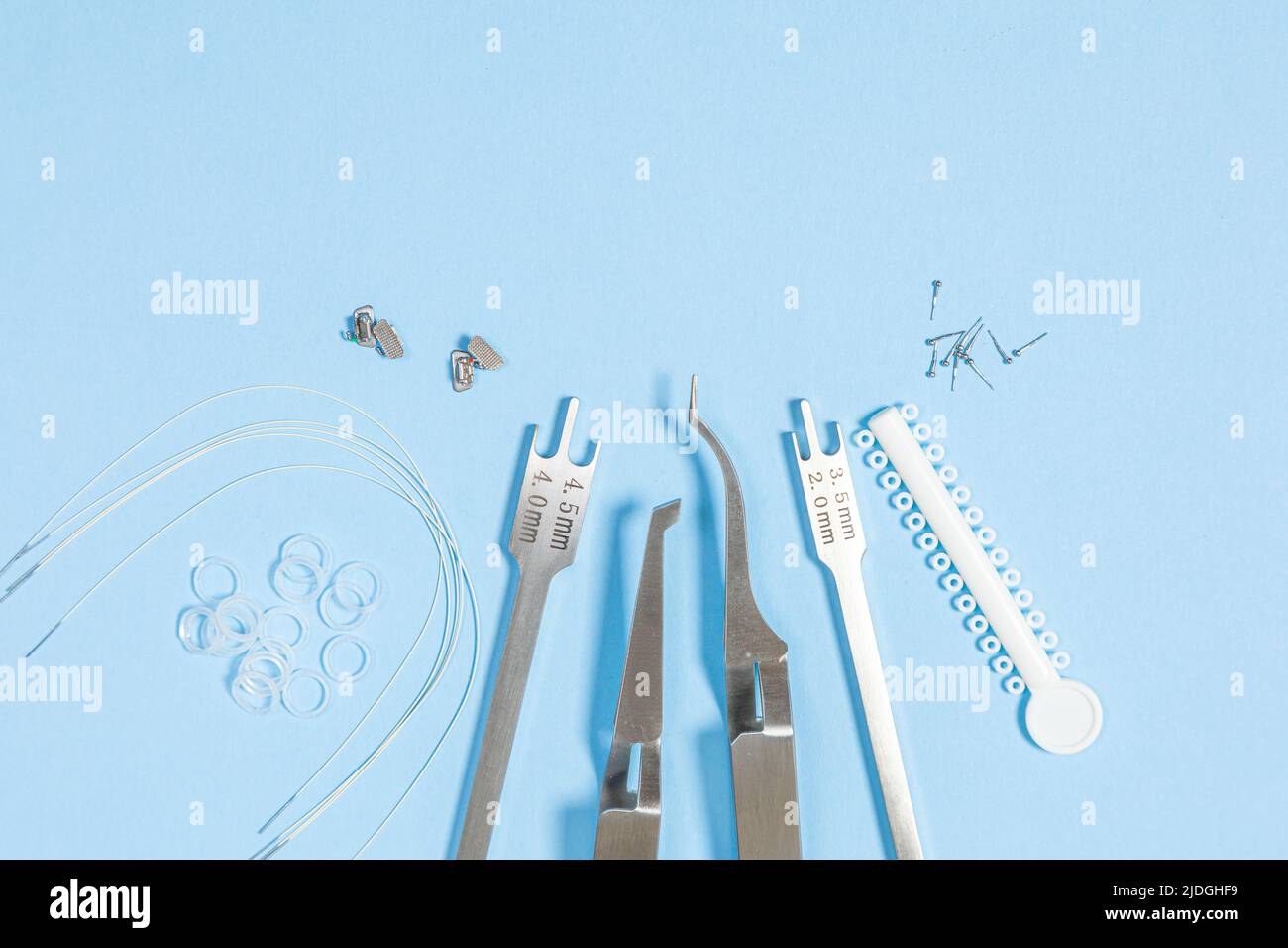 a set of special tools for an orthodontist to install braces for a ...