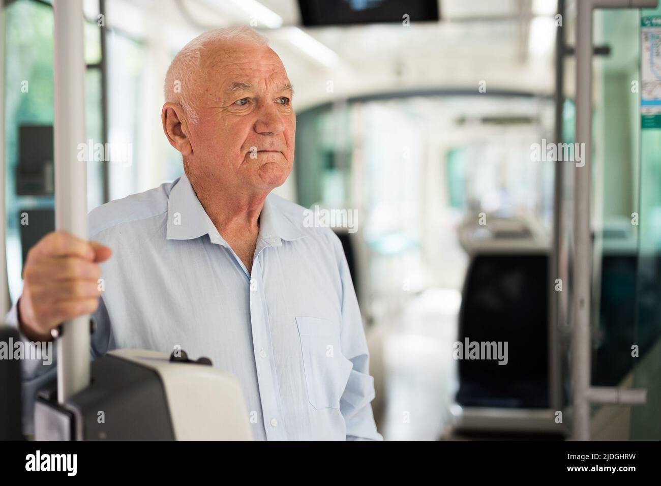 Old man in streetcar Stock Photo - Alamy