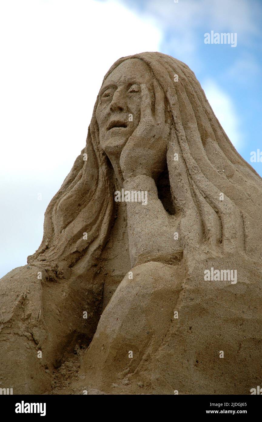 Sand sculpture of a sad woman Stock Photo - Alamy