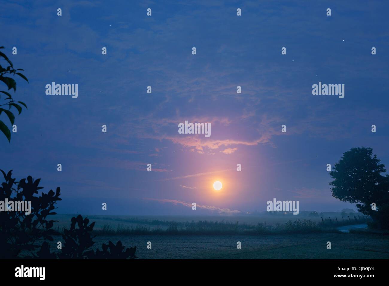 Night scenery with full moon shining over a rural landscape on a ...